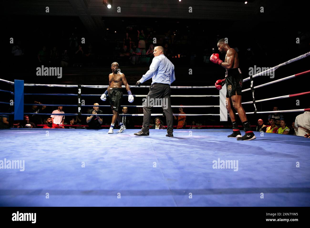 Tristan Brookes (red gloves) faces Mikhail Miller during a boxing match ...