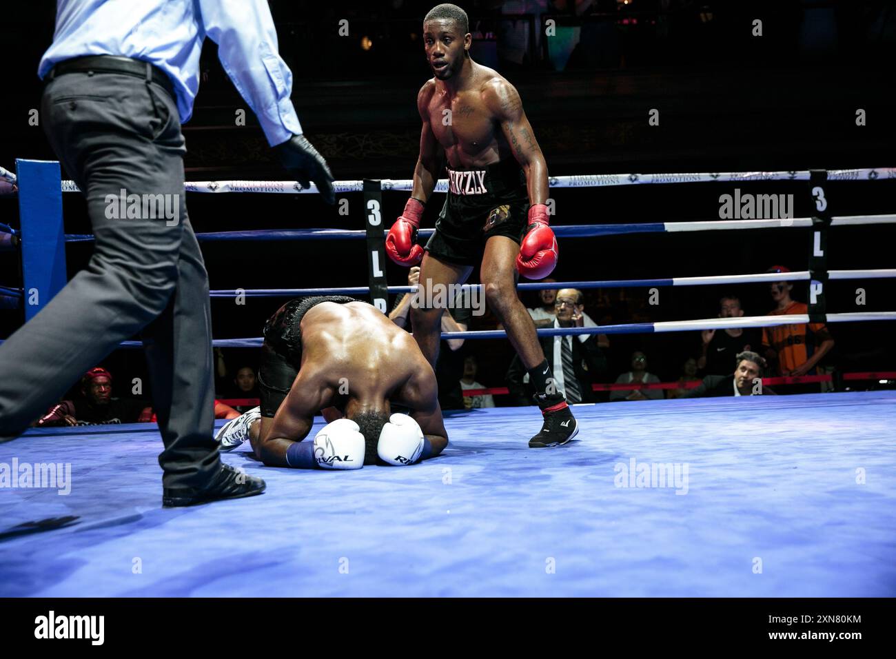 Tristan Brookes (red gloves) faces Mikhail Miller during a boxing match ...