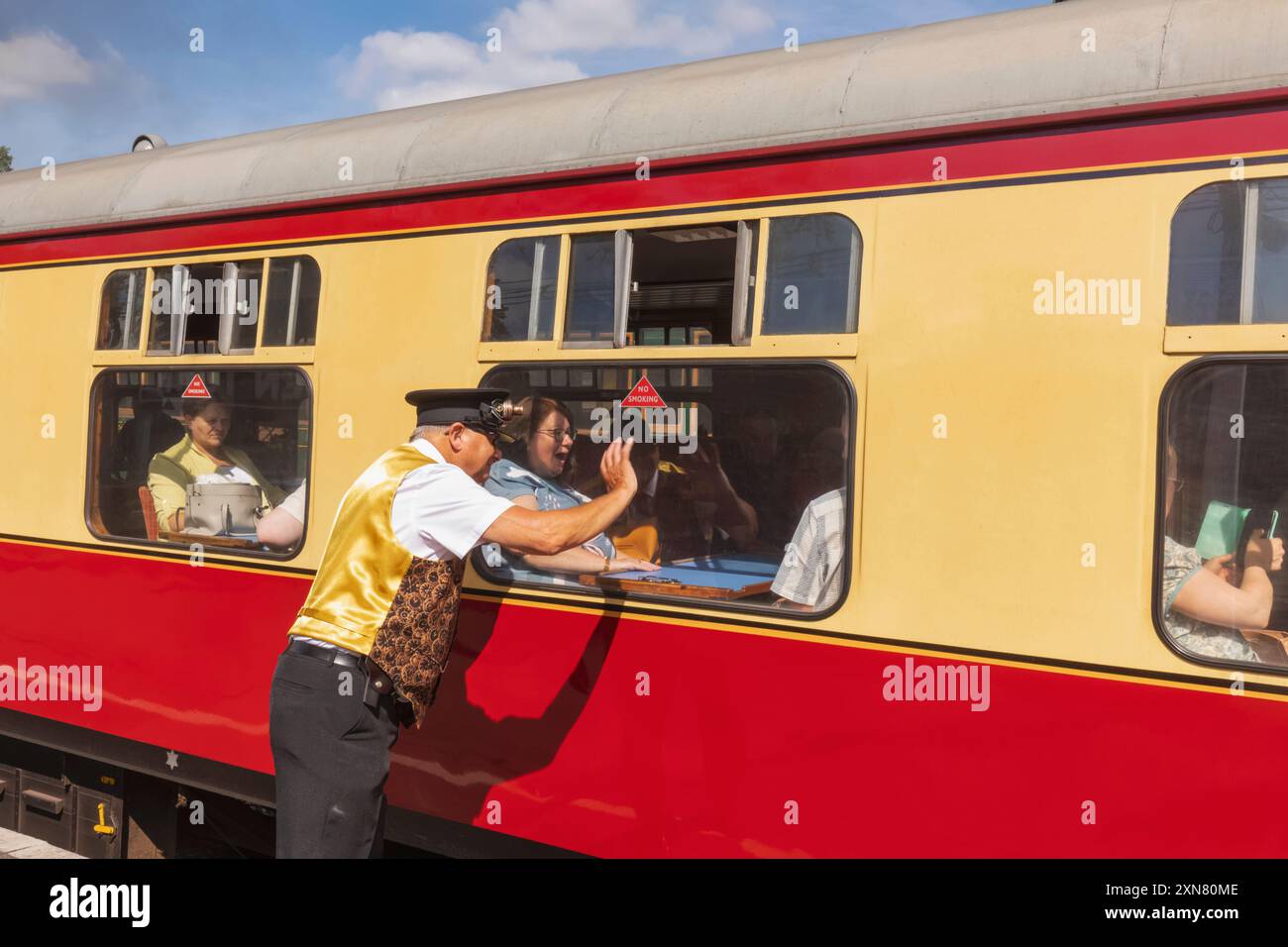 Platform guard waving goodbye to passengers hi-res stock photography and images - Alamy
