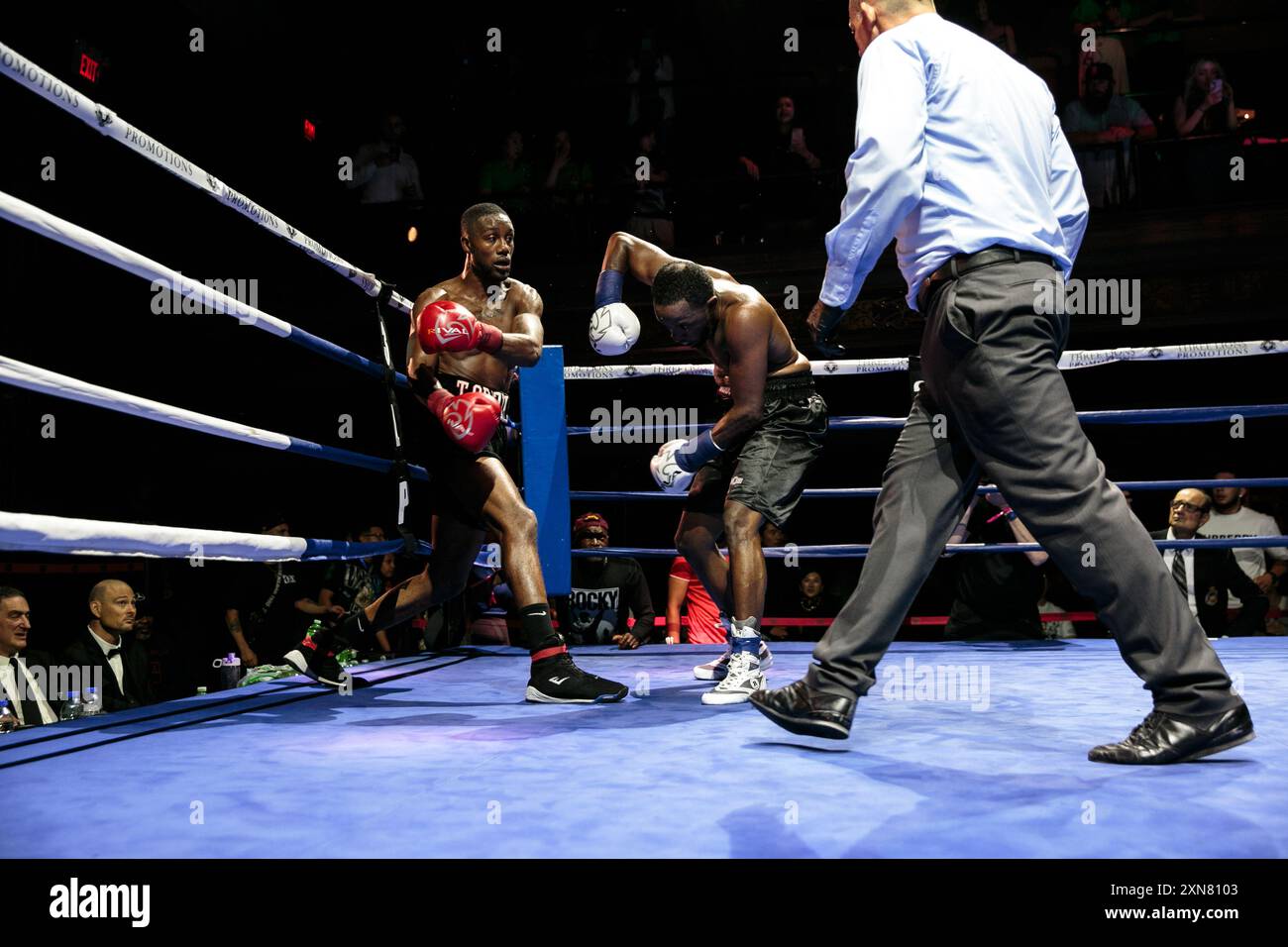 Tristan Brookes (red gloves) faces Mikhail Miller during a boxing match ...
