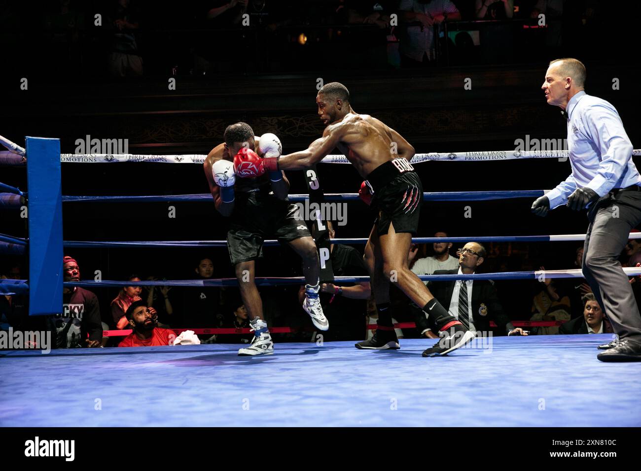 Tristan Brookes (red gloves) faces Mikhail Miller during a boxing match ...