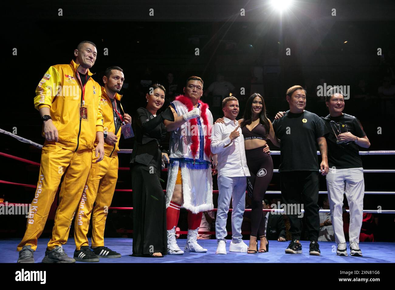 Junlong "The Dragon King" Zhang, in red and white gloves, celebrates a ...