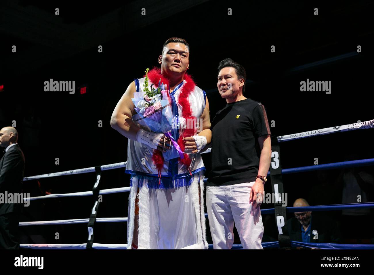 Junlong "The Dragon King" Zhang, in red and white gloves, celebrates a ...
