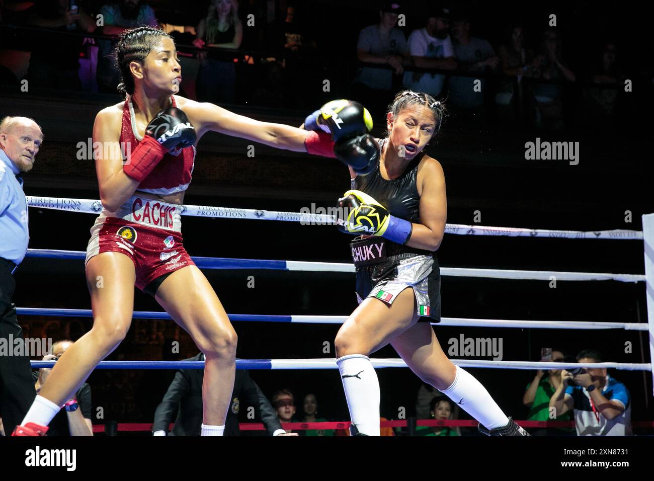 Meilyn Martinez (red trunks) and Shadem Aguilar face off during a ...