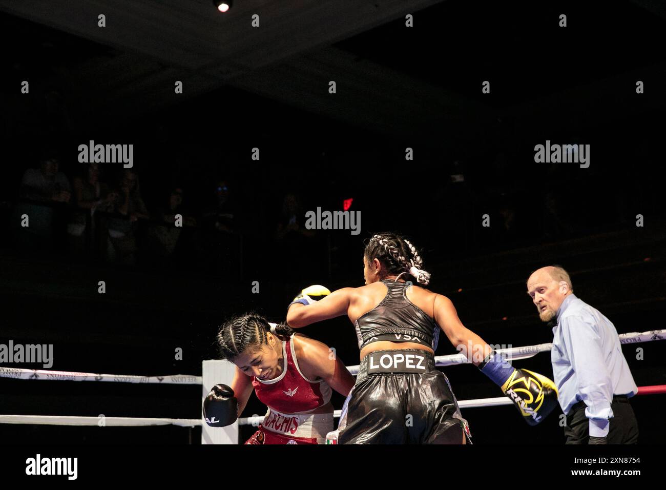 Meilyn Martinez (red trunks) and Shadem Aguilar face off during a ...