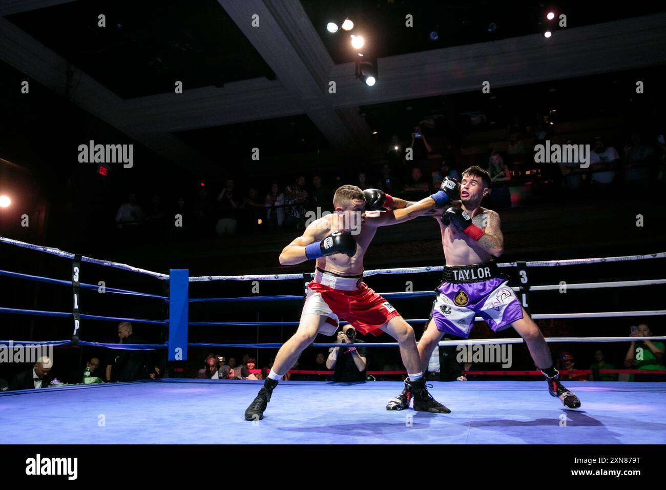 Dylan Taylor (purple trunks) faces Vitalii Maksymiv (red trunks) during ...