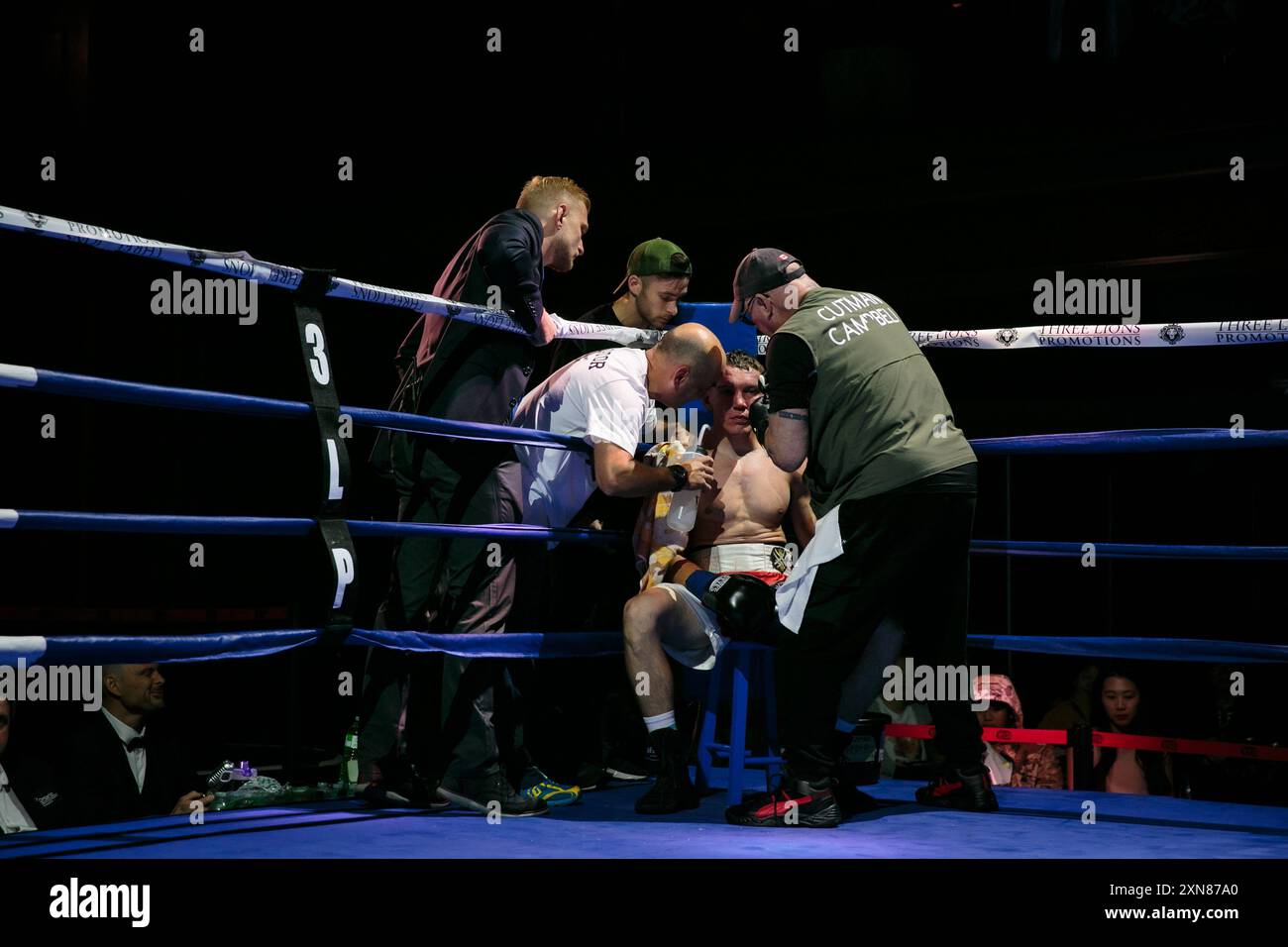 Dylan Taylor (purple trunks) faces Vitalii Maksymiv (red trunks) during a boxing match held at ...