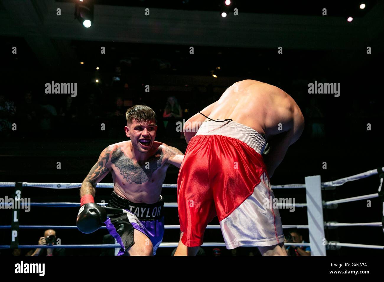 Dylan Taylor (purple trunks) faces Vitalii Maksymiv (red trunks) during ...