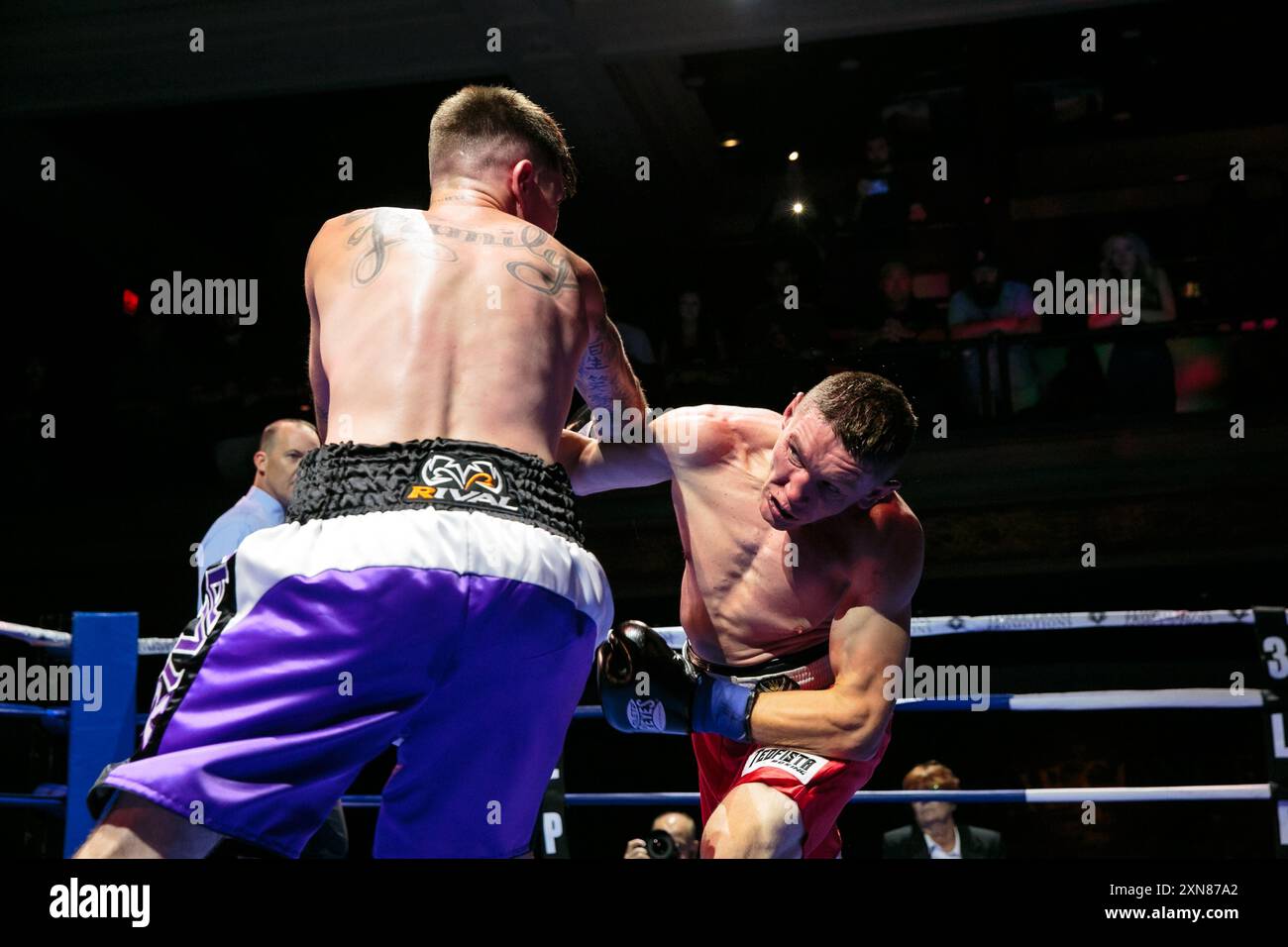 Dylan Taylor (purple trunks) faces Vitalii Maksymiv (red trunks) during ...