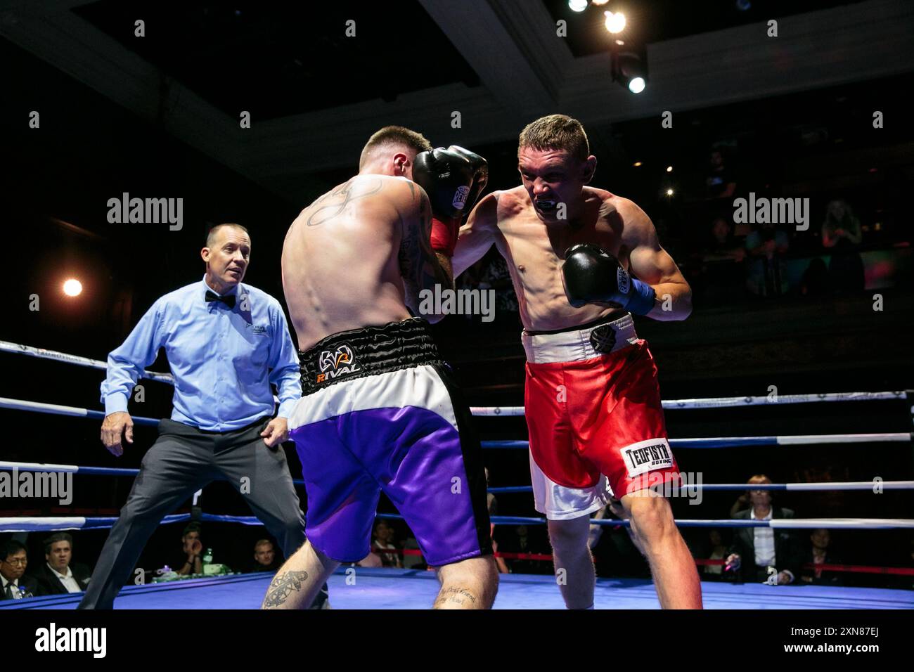 Dylan Taylor (purple trunks) faces Vitalii Maksymiv (red trunks) during ...