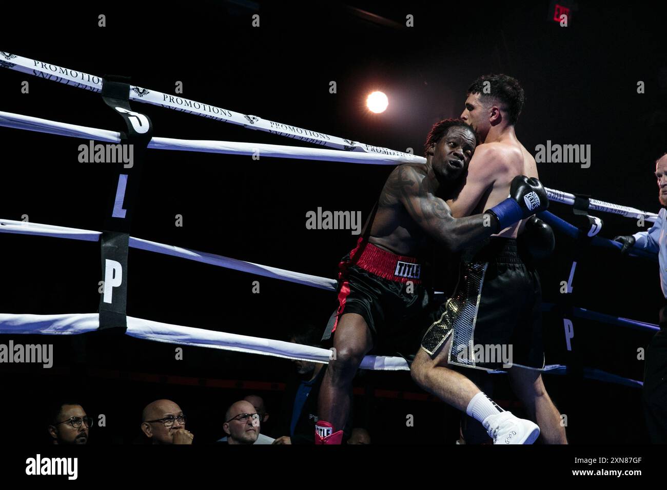 Antonia Scaringi (red gloves) faces Roddy Rene (black gloves) during a ...