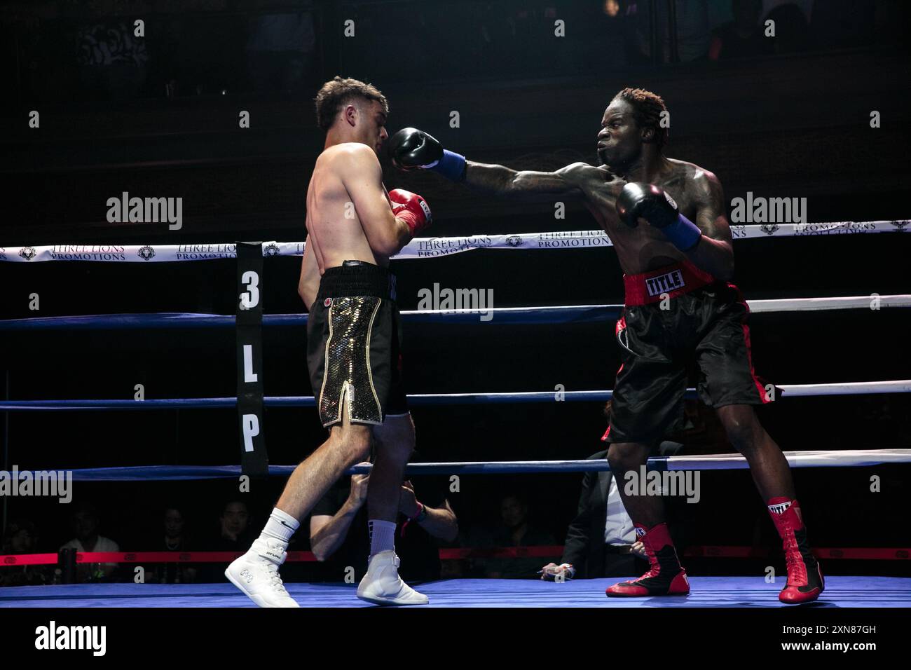 Antonia Scaringi (red gloves) faces Roddy Rene (black gloves) during a ...