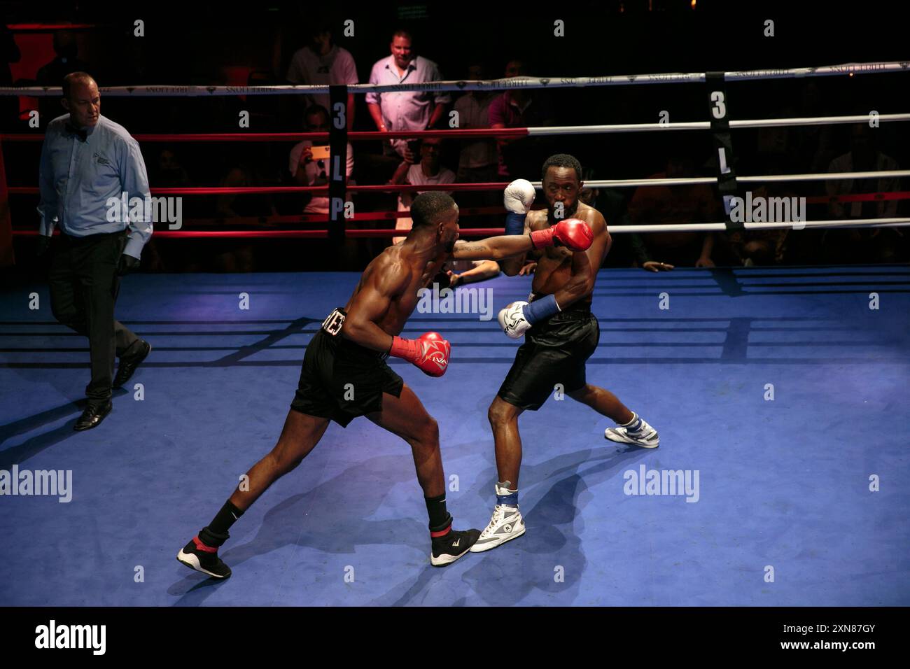 Tristan Brookes (red gloves) faces Mikhail Miller during a boxing match ...