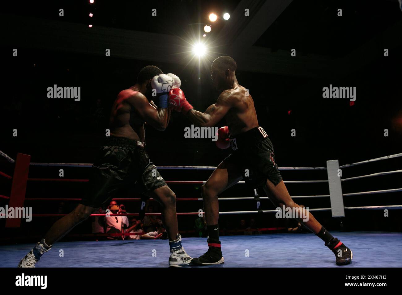 Tristan Brookes (red gloves) faces Mikhail Miller during a boxing match ...