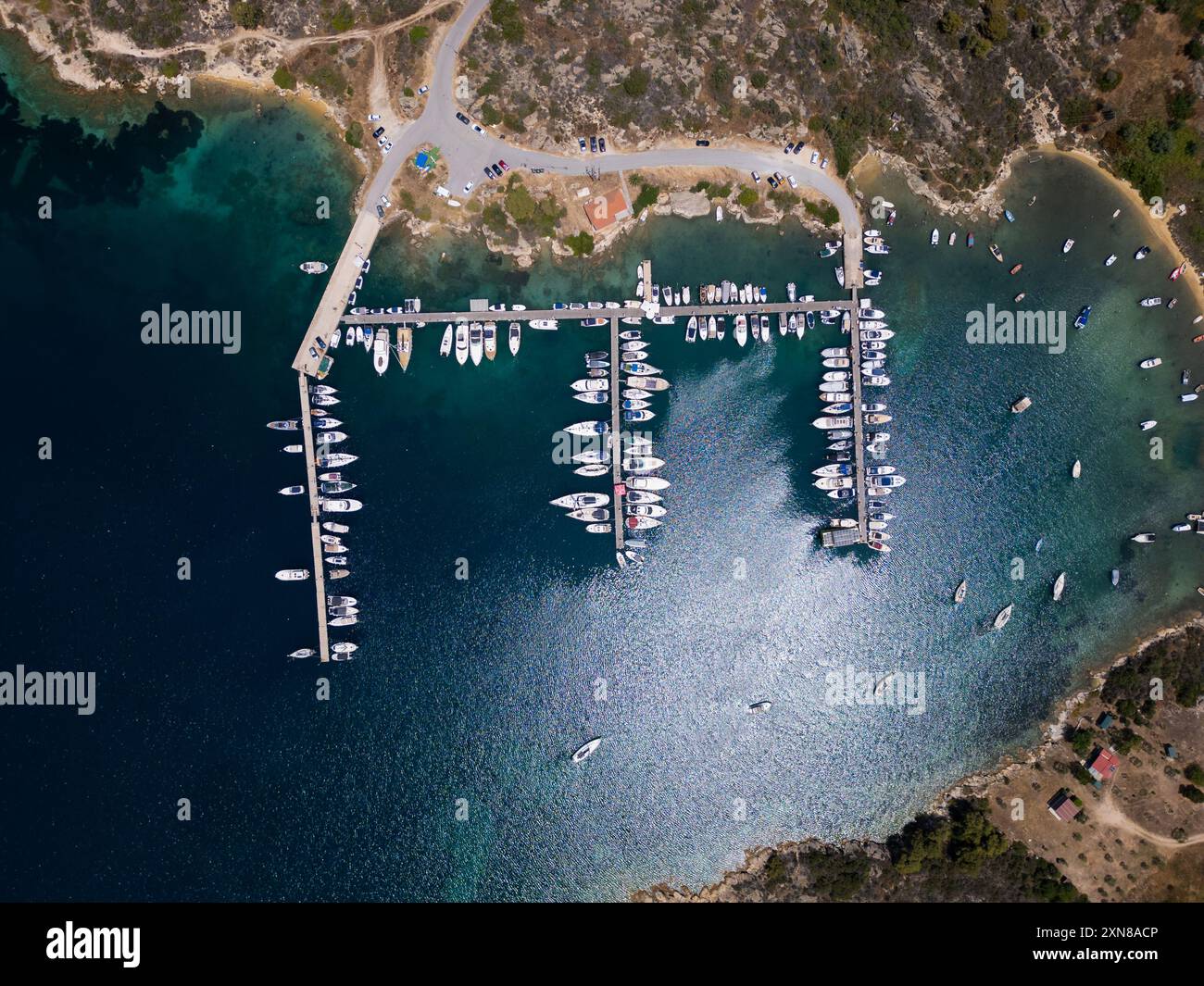 Aerial view of a marina in Sithonia, Greece, with numerous boats and ...