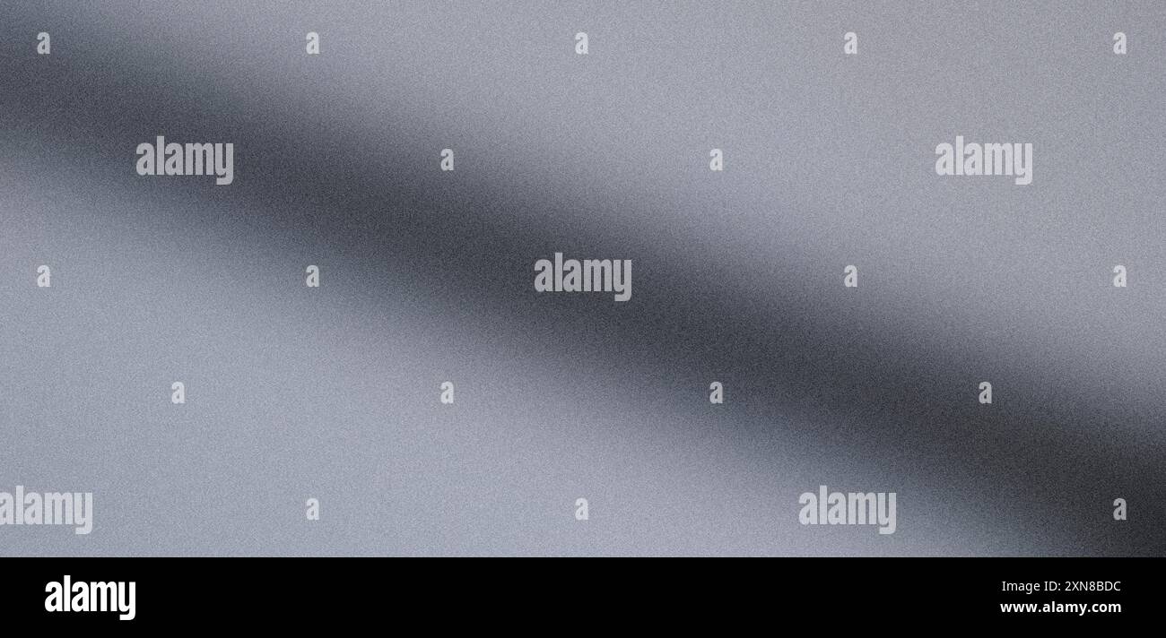 Light beam diagonally creating a gradient on a textured grainy surface ...