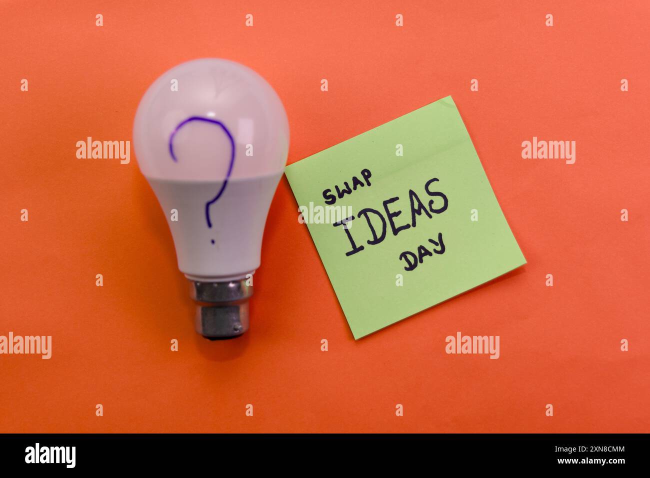 Lightbulb and note with "Swap Ideas Day" inspire creative collaboration ...