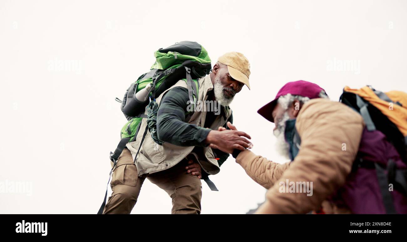 Fitness, hiking and senior men with helping hand for support, physical ...