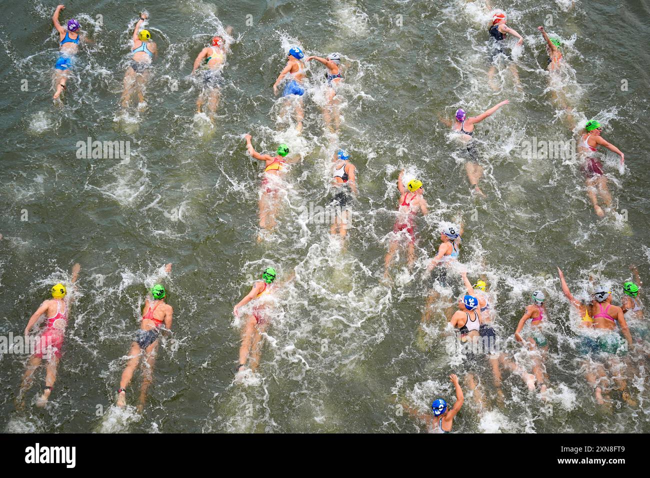 Athletes compete in the swim leg of the women's individual triathlon ...
