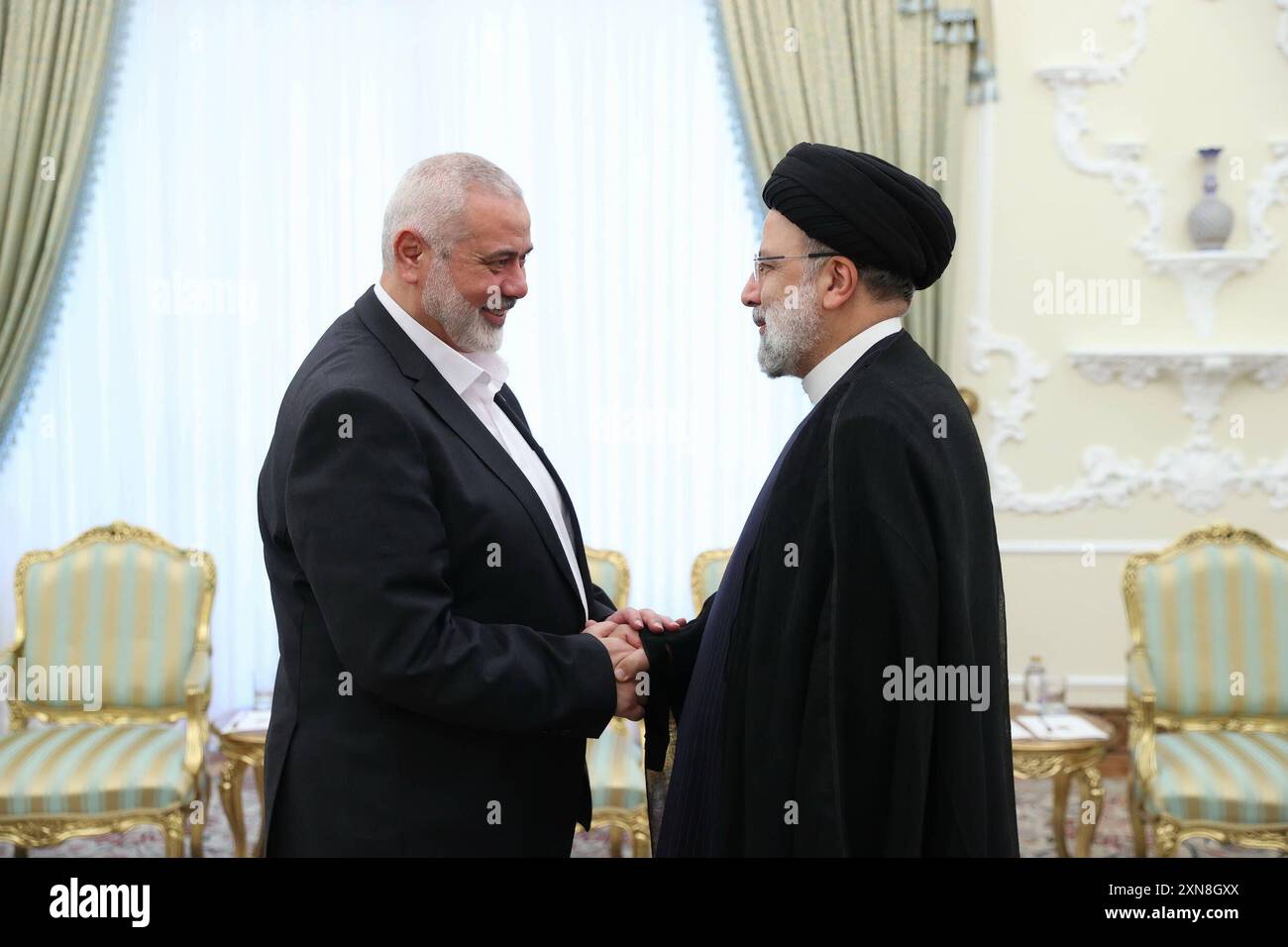 Iranian President Ibrahim Raisi receives a delegation from the ...