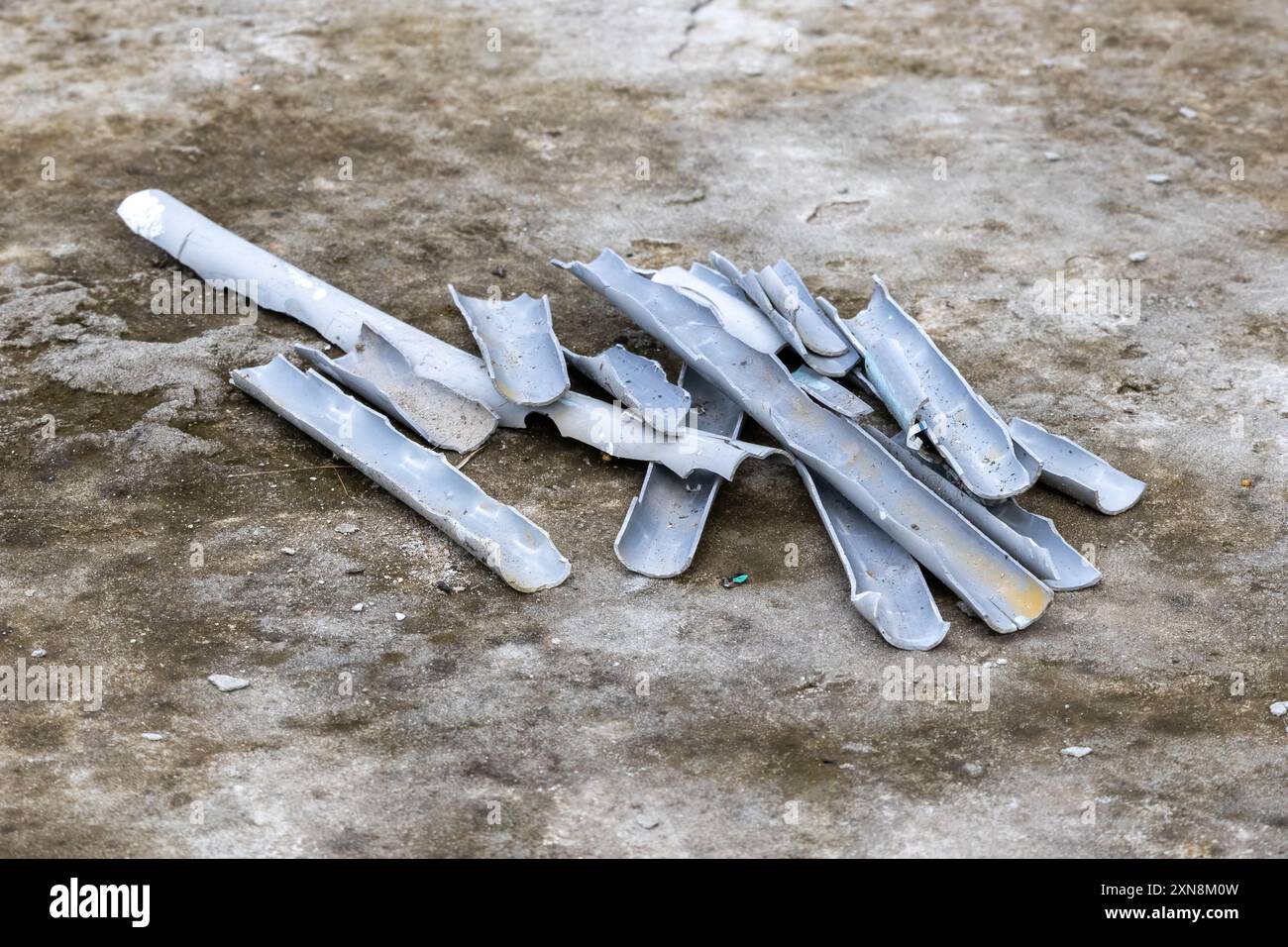 Broken pieces of plastic pipes used in building fittings work. They are ...