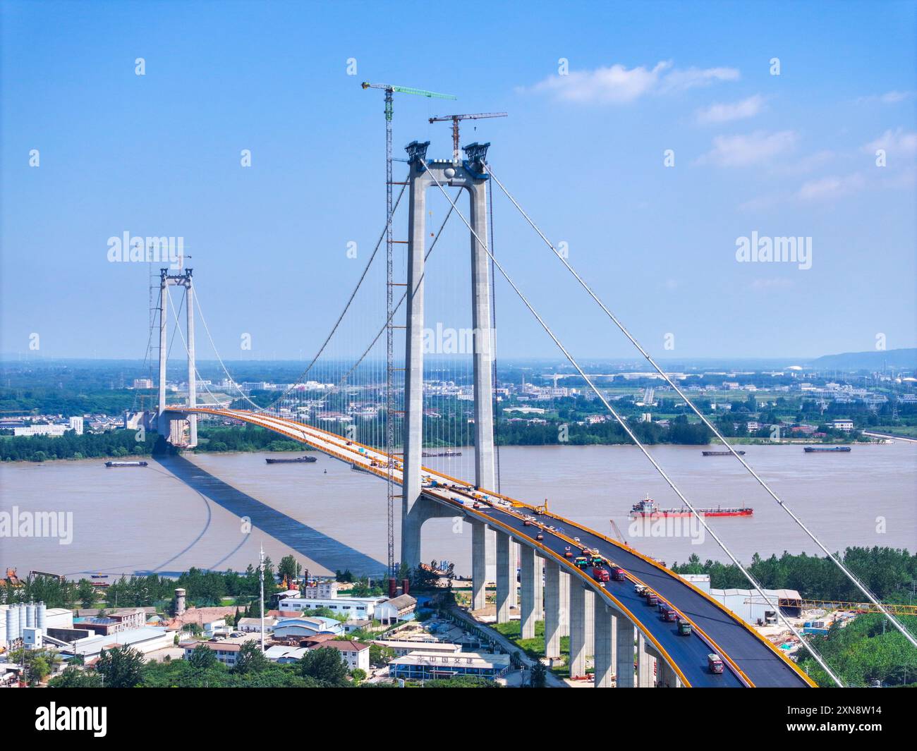 NANJING, CHINA - JULY 31, 2024 - Construction workers carry out asphalt ...