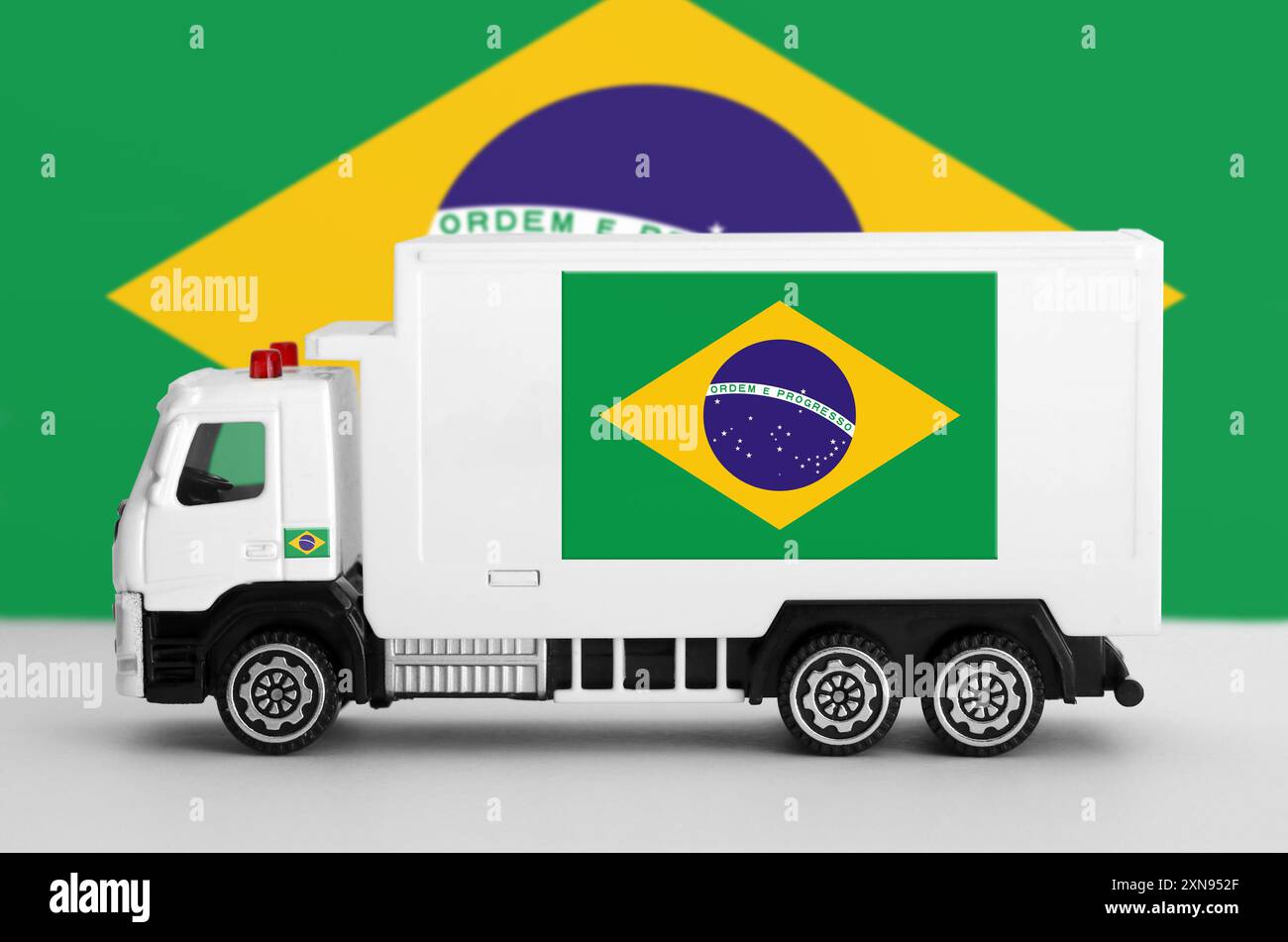 Brazil flag depicted on side wall of white delivery van close up ...