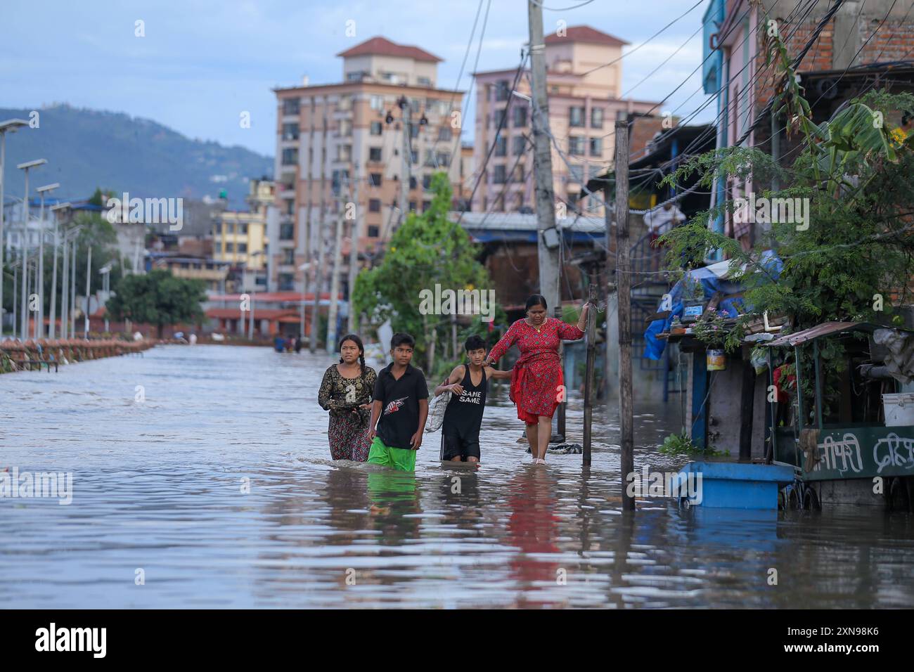 Heavy rain flood houses in Nepal People are wading through the flood in ...