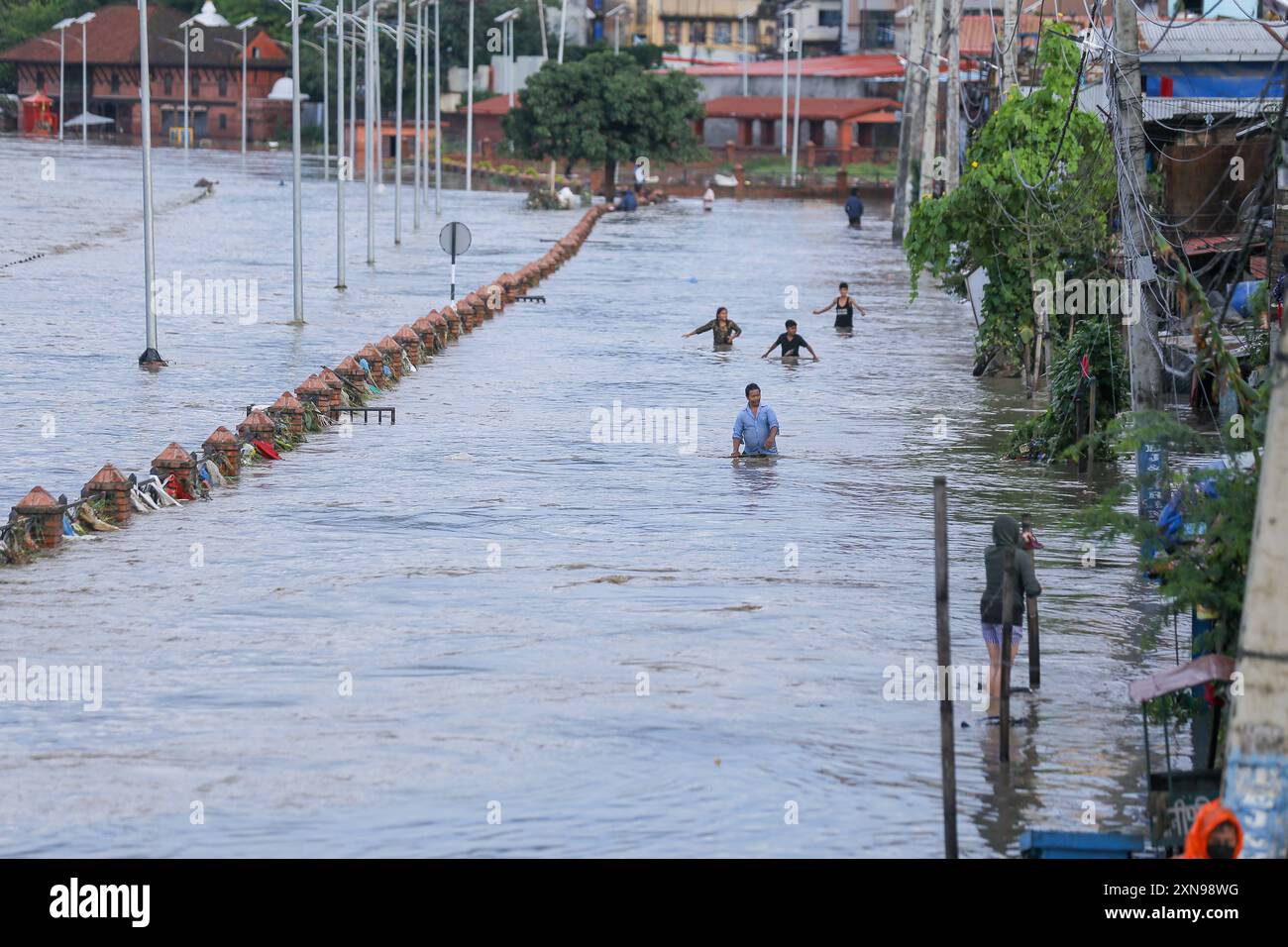 Heavy rain flood houses in Nepal People are wading through the flood in ...