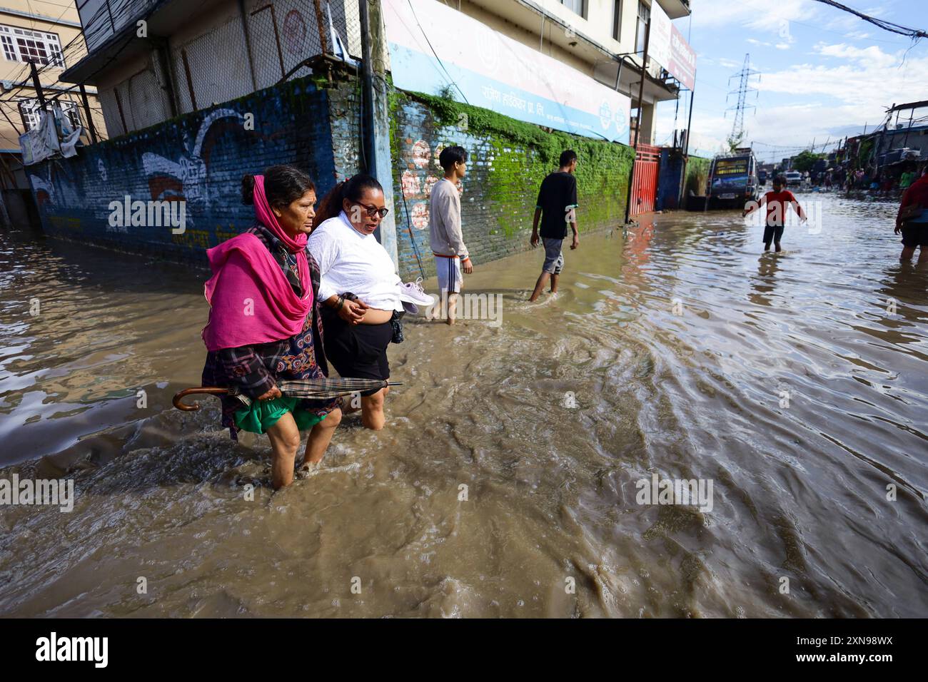 Heavy rain flood houses in Nepal People are wading through the flood in ...