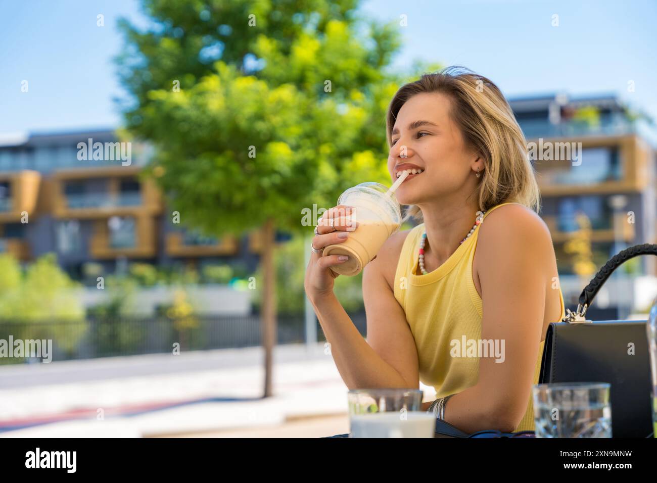 Stylish woman sips beverage hi-res stock photography and images - Alamy