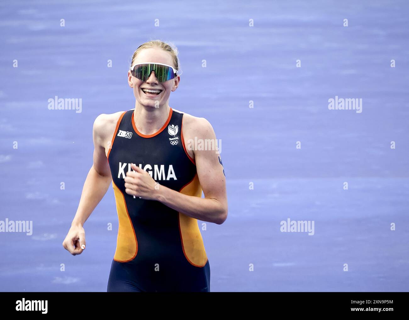 PARIS - Triathlete Maya Kingma crosses the finish line during the ...