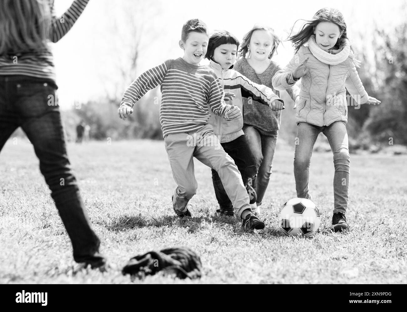 Children playing football Black and White Stock Photos & Images - Alamy