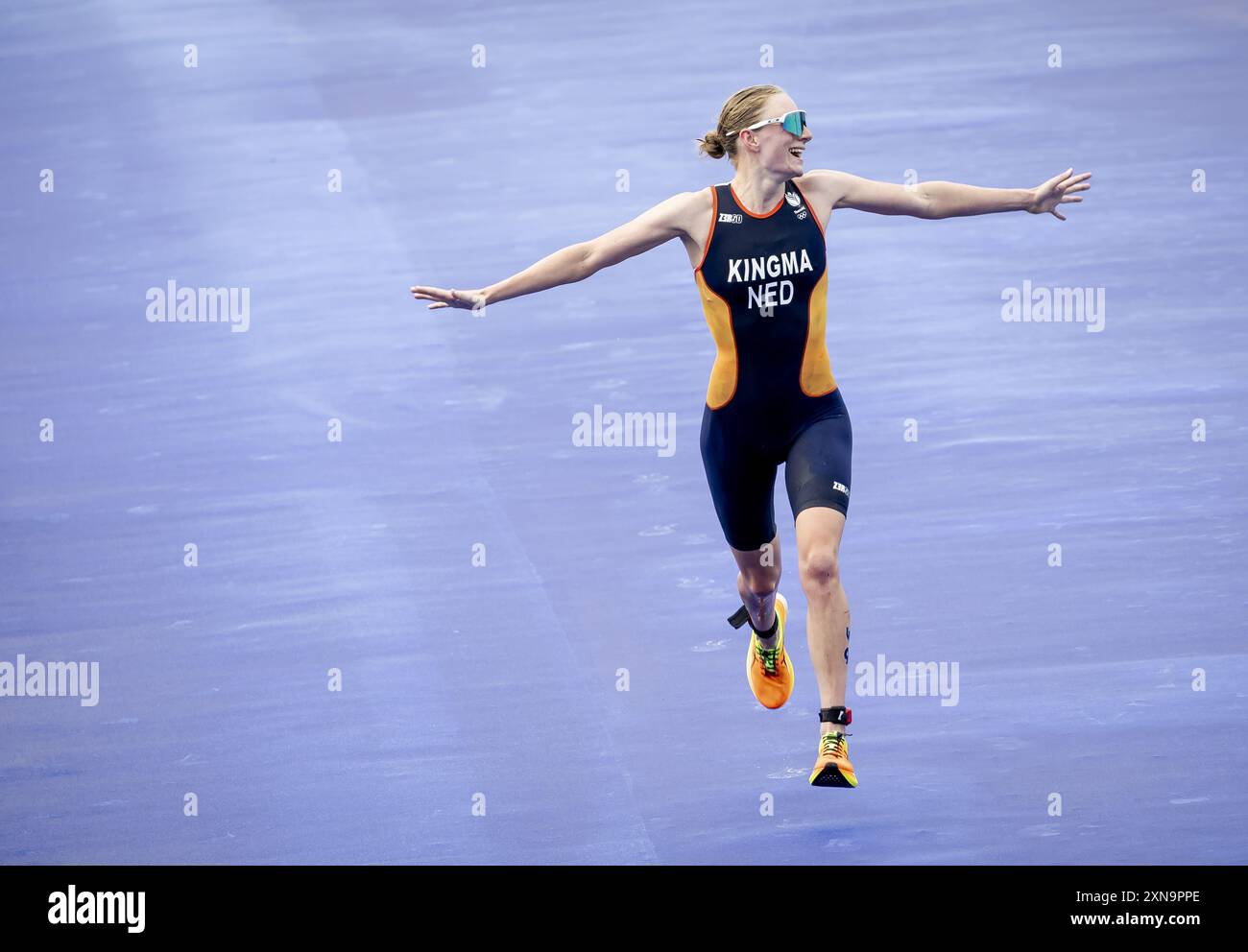 PARIS - Triathlete Maya Kingma crosses the finish line during the ...