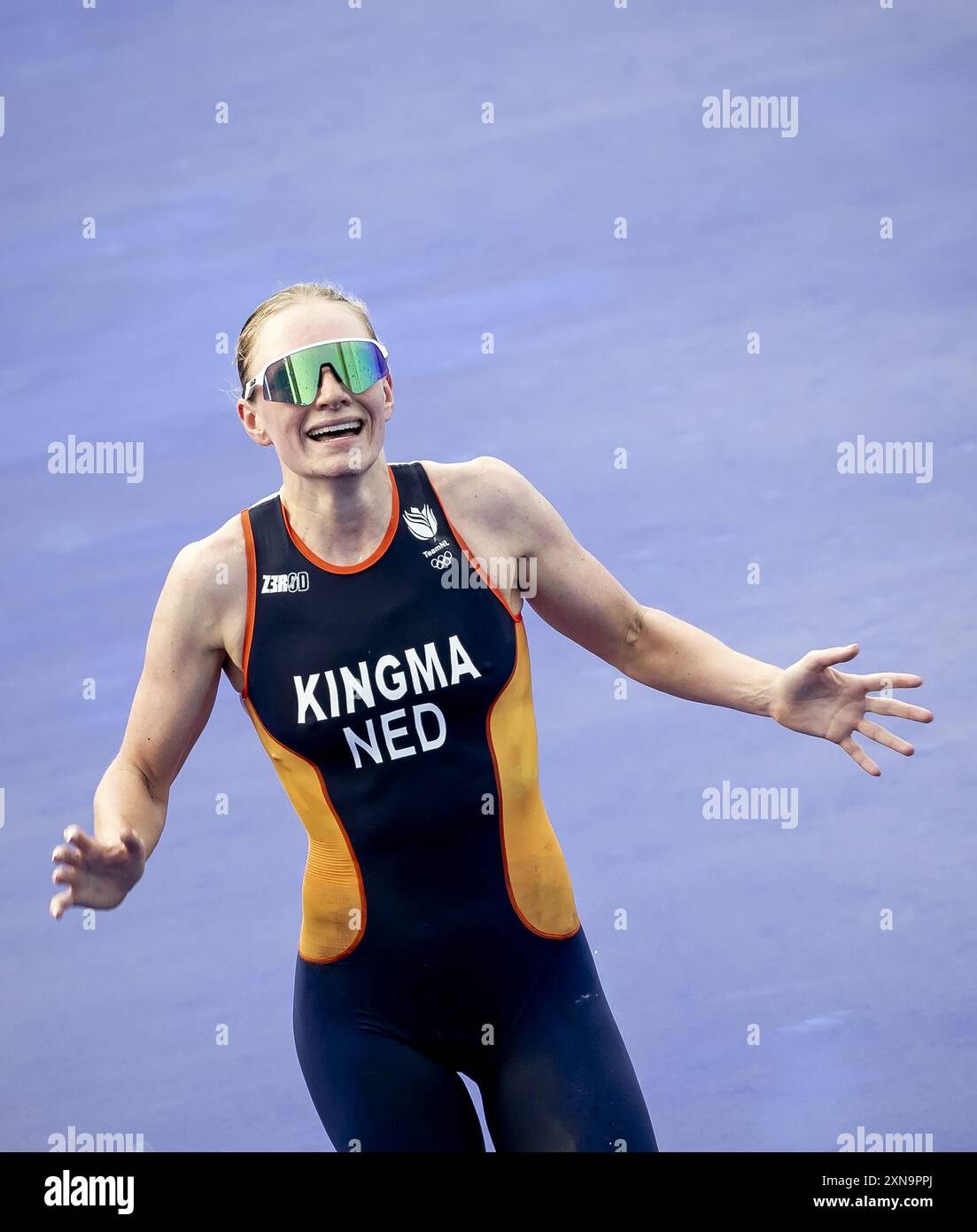 PARIS - Triathlete Maya Kingma crosses the finish line during the ...