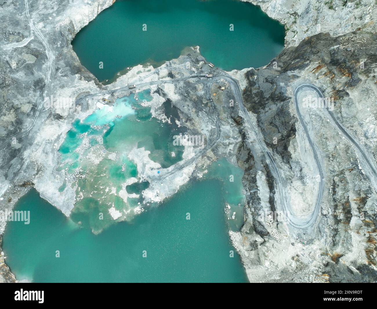 Open pit mine industry. Limestone quarry with backhoe and truck in ...