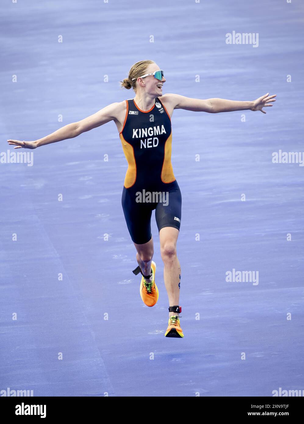 PARIS - Triathlete Maya Kingma crosses the finish line during the ...