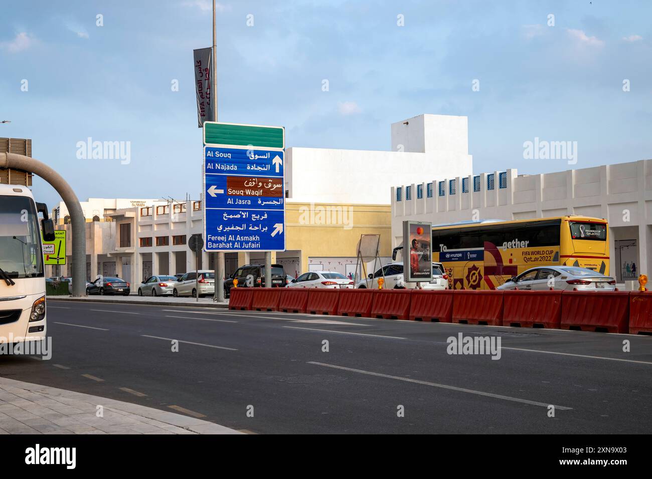 FIFA World Cup red buss with selective focus. Doha Roads and traffic ...