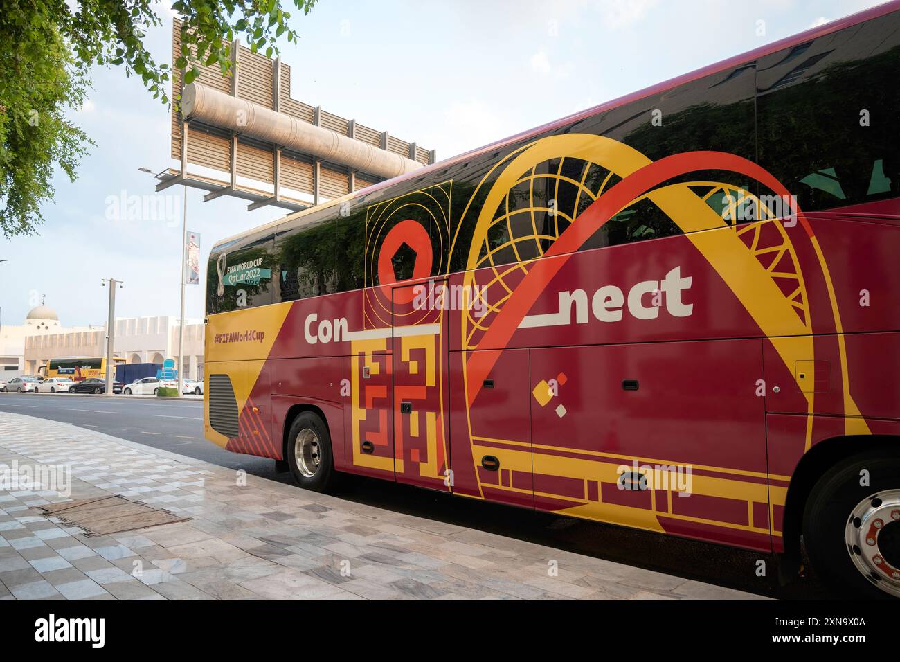FIFA World Cup red buss with selective focus. Doha Roads and traffic ...