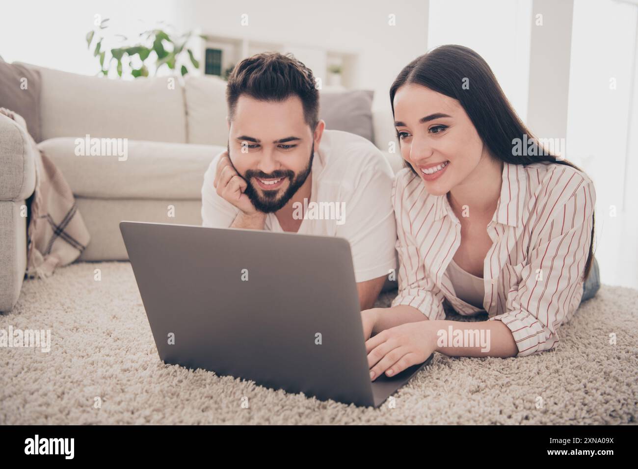 Photo of pretty cheerful lady guy wear casual looks typing sms modern ...