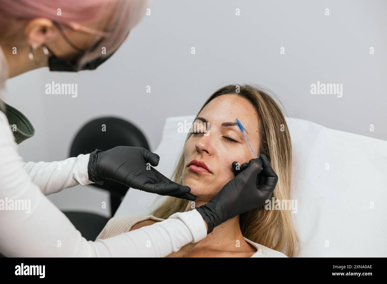 Microblading eyebrow tattoo procedure in progress Stock Photo - Alamy