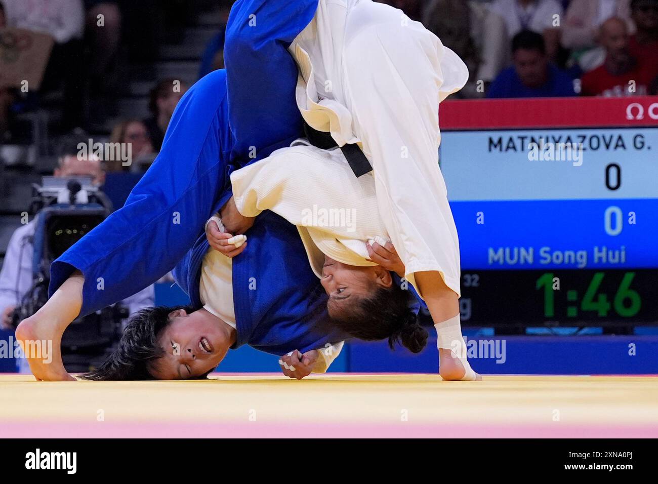 Uzbekistan's Gulnoza Matniyazova and North Korea Song Hui Mun, left ...