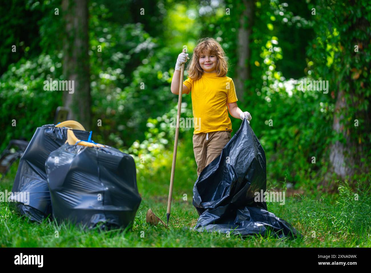 Kid helps to pick up garbage. Pollute forest. Rubbish trash. Planet ...