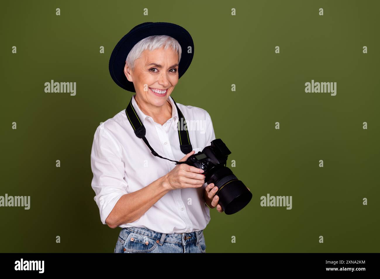 Photo of shiny attractive lady photographer dressed white shirt cap ...