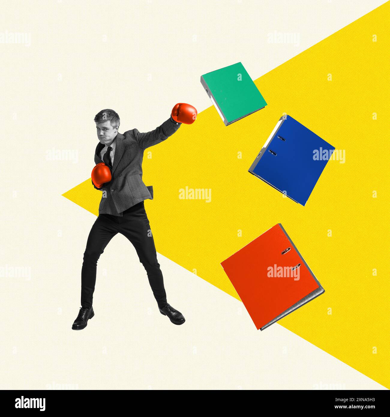 Businessman in boxing gloves hitting folders with documents ...
