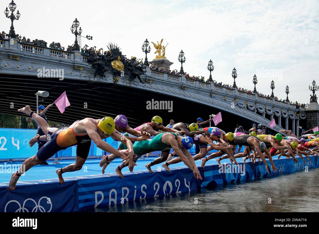 Athletes dive into the water for the start of the men's individual ...