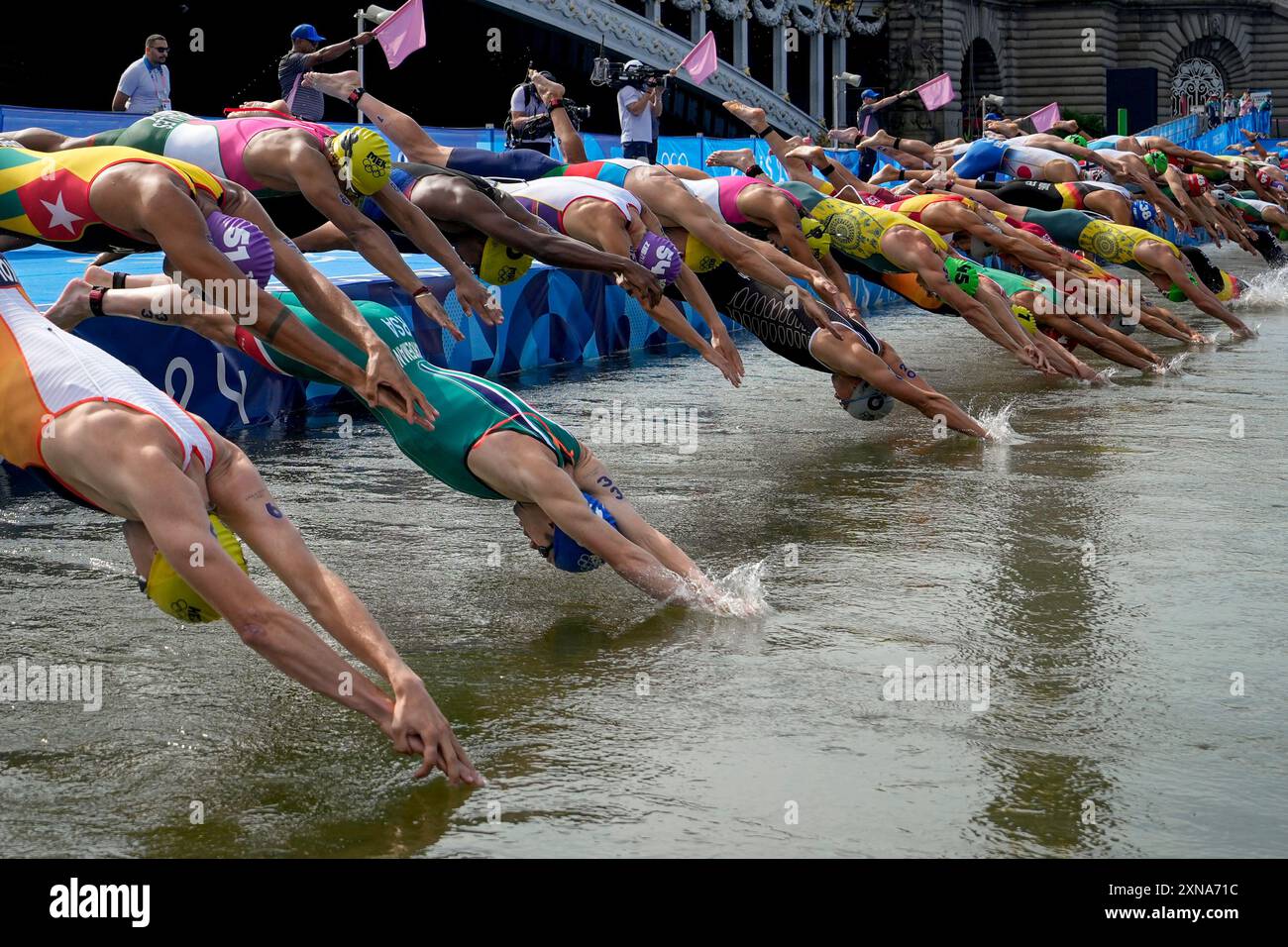 Athletes dive into the water for the start of the men's individual ...