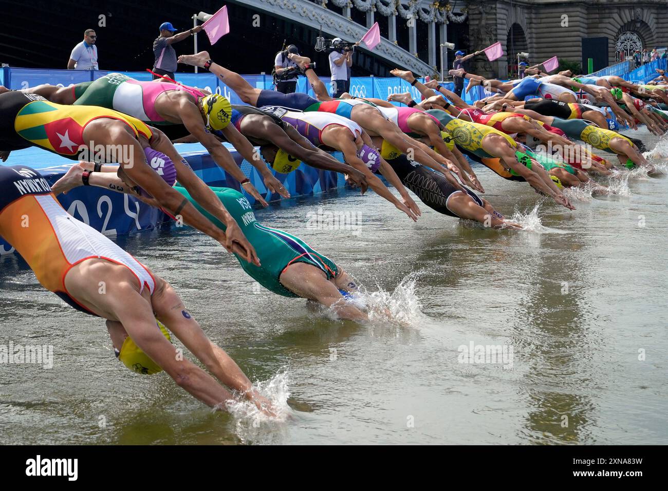 Athletes dive into the water for the start of the men's individual ...