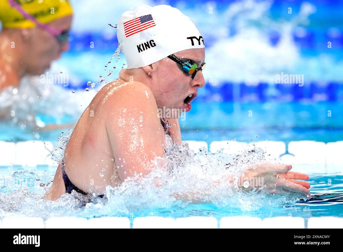 Lilly King, of the United States, competes during a heat in the women's ...