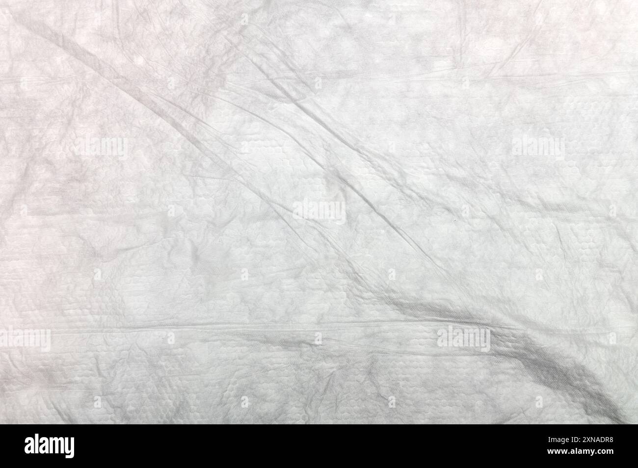 Crumpled white diaper. Close up of white flat sheets with texture. Top ...
